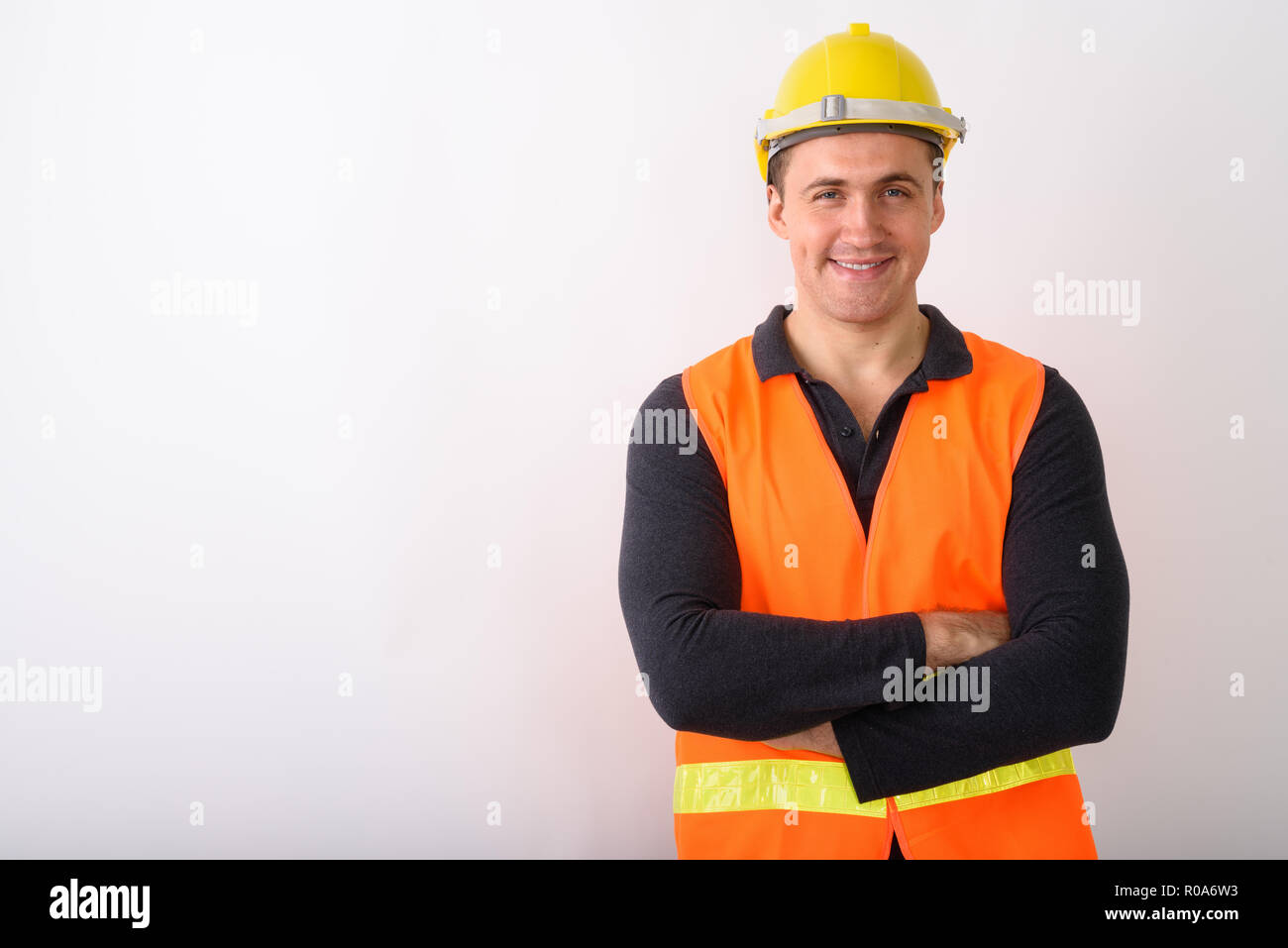 Portrait of young man construction worker standing Stock Photo - Alamy