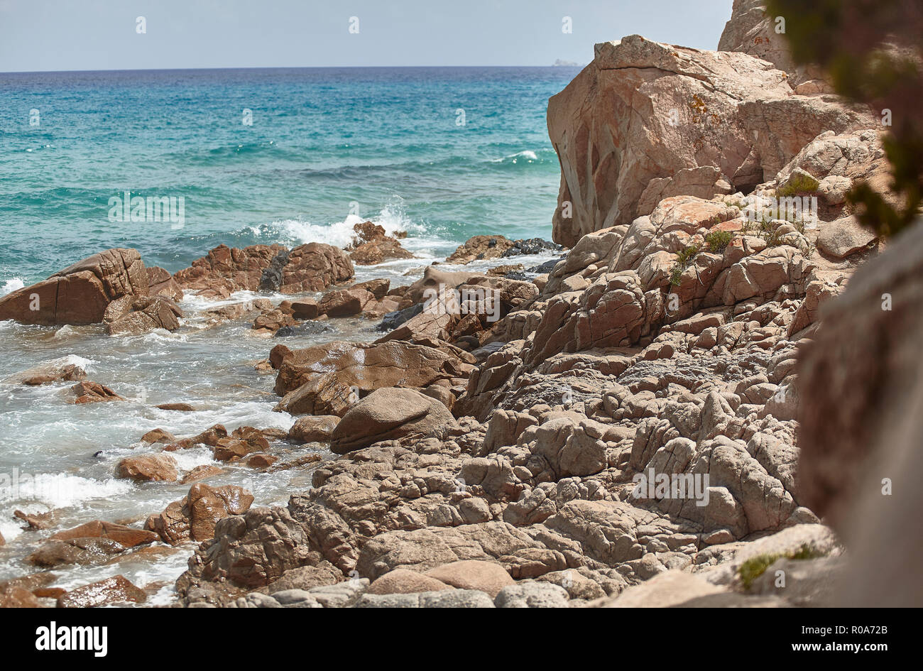 Rocks emerging from sea hi-res stock photography and images - Alamy