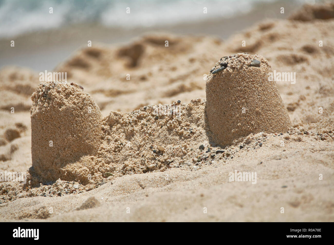 Sand castle built on the beach: a symbol of fun and relaxation during ...