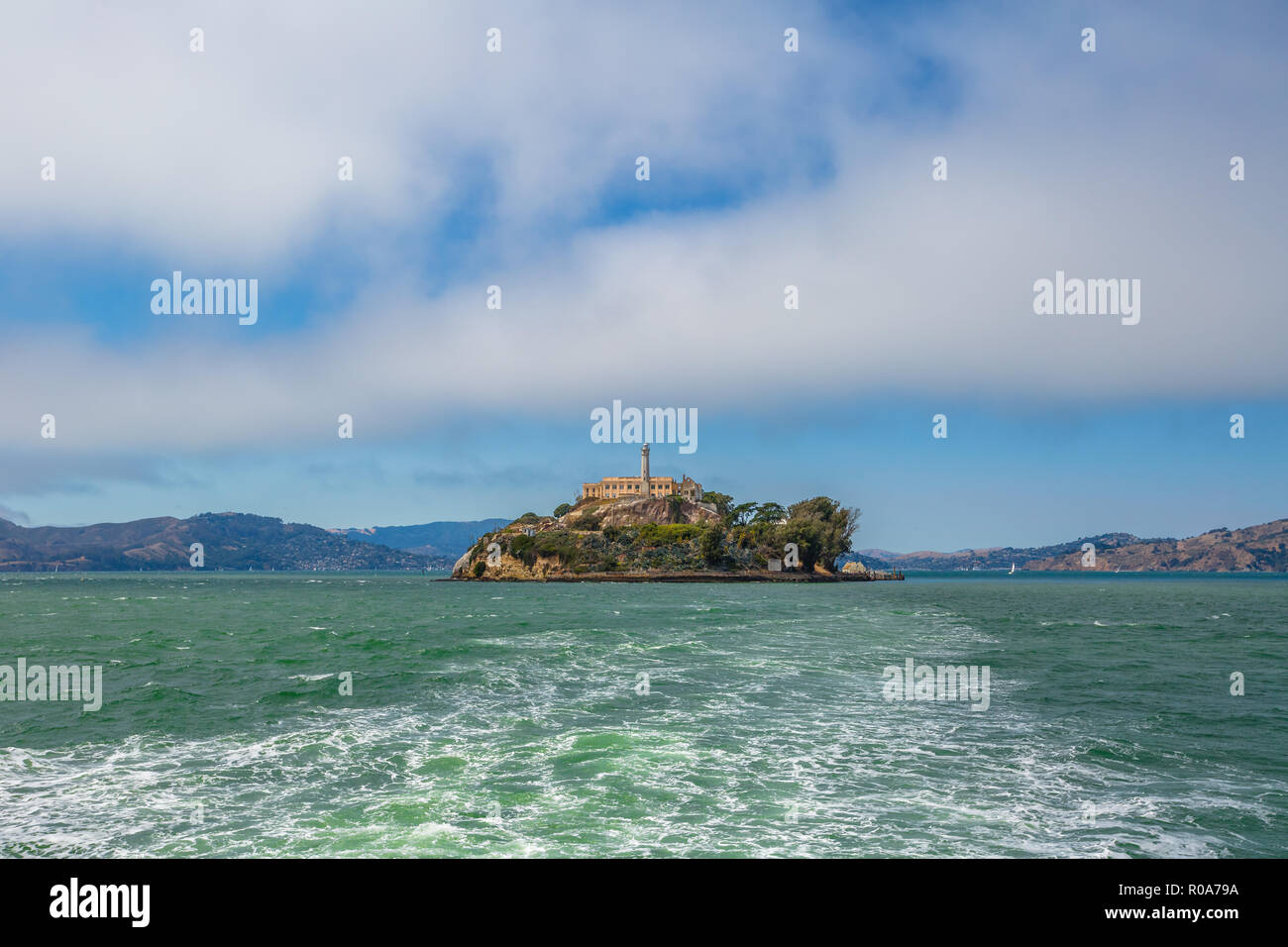 Sea view panorama leaving by boat the prison Alcatraz in San Francisco ...