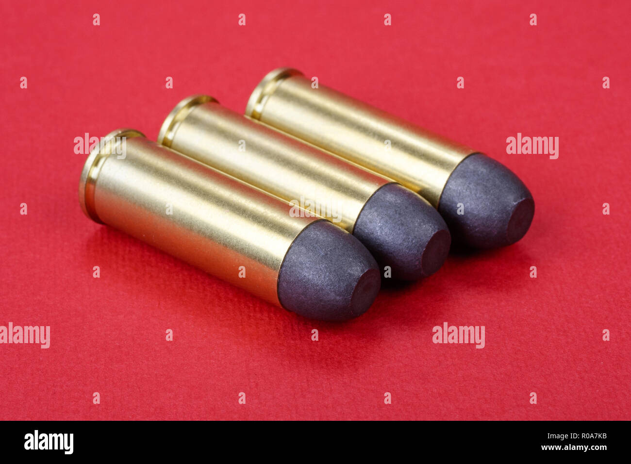Black-powder revolver rounds .45 cal. dating to 1872 on red background ...