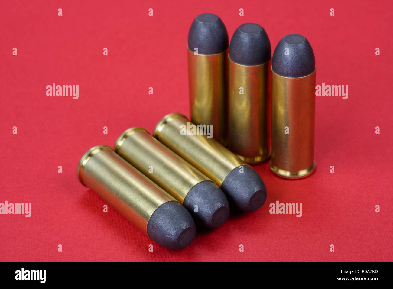 Black-powder revolver rounds .45 cal. dating to 1872 on red background ...