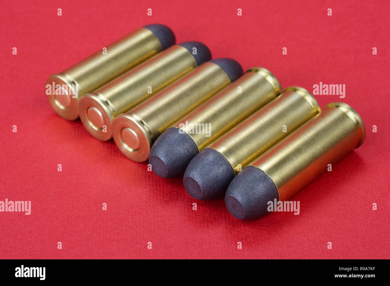 Black-powder revolver rounds .45 cal. dating to 1872 on red background ...