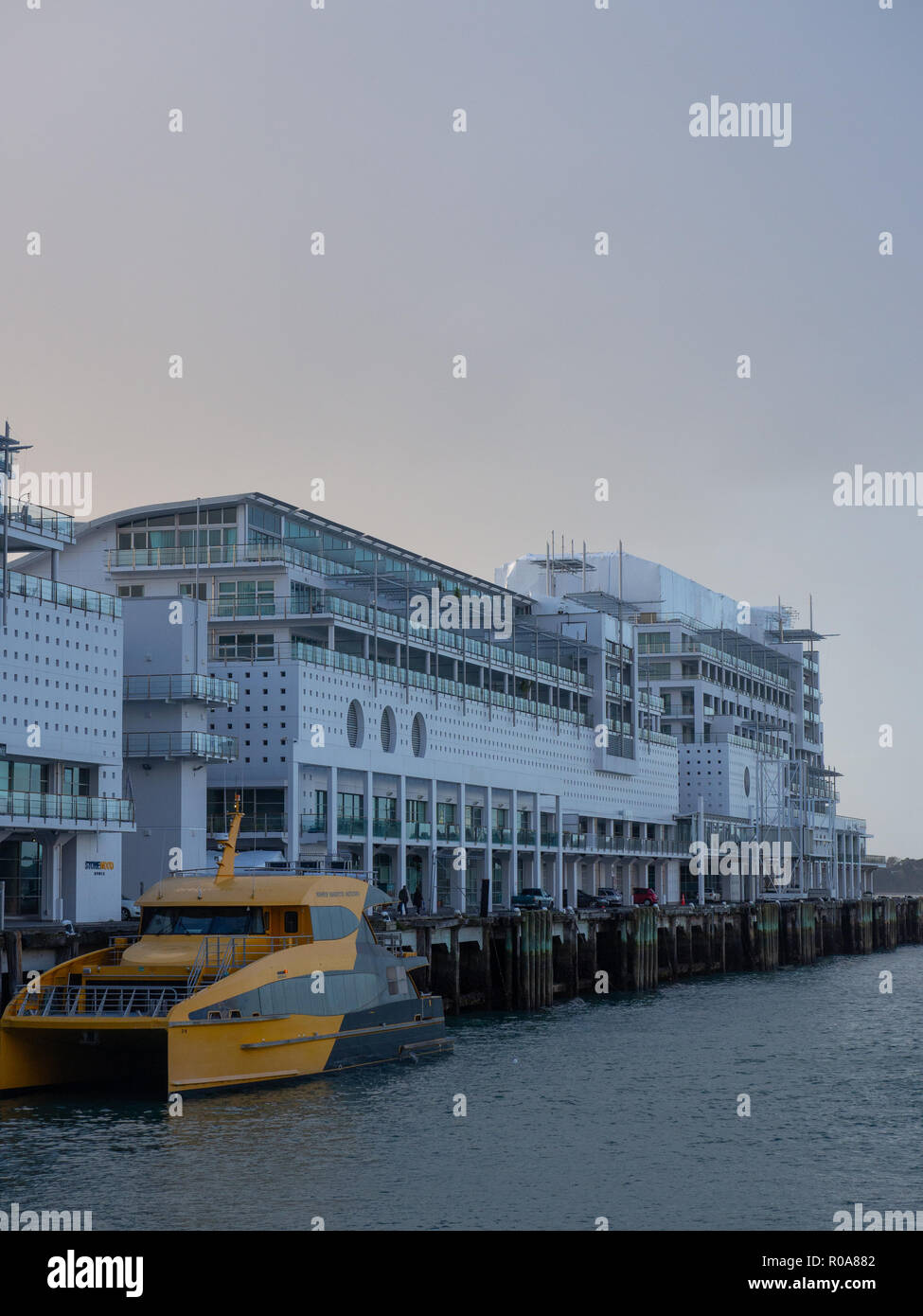 Ferry Docked At A Wharf In Auckland Stock Photo - Alamy