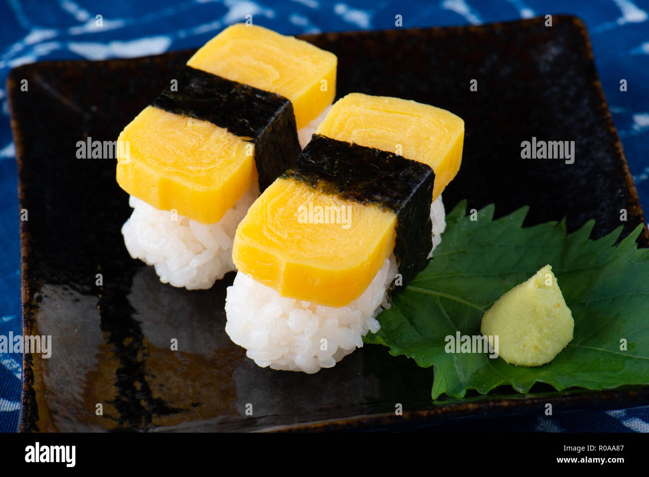 Japanese sweet egg sushi in plate to serve Stock Photo - Alamy
