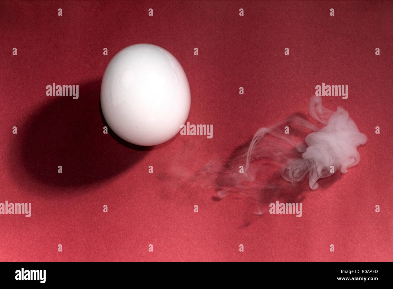 soap bubble with smoke next to a burst on a red background Stock Photo ...