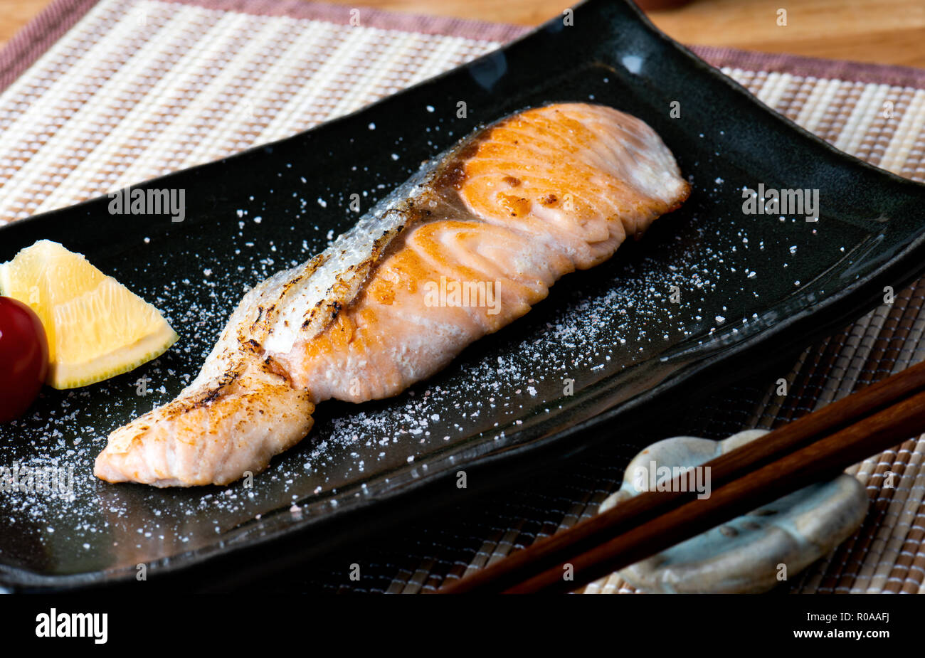 Salmon grilled with salt in Japanese style food cooking Stock Photo - Alamy