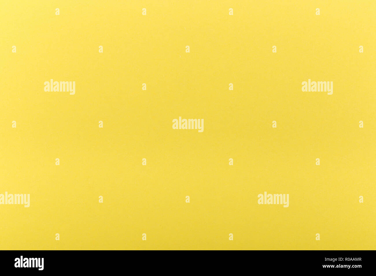 yellow colored paper texture background image Stock Photo - Alamy