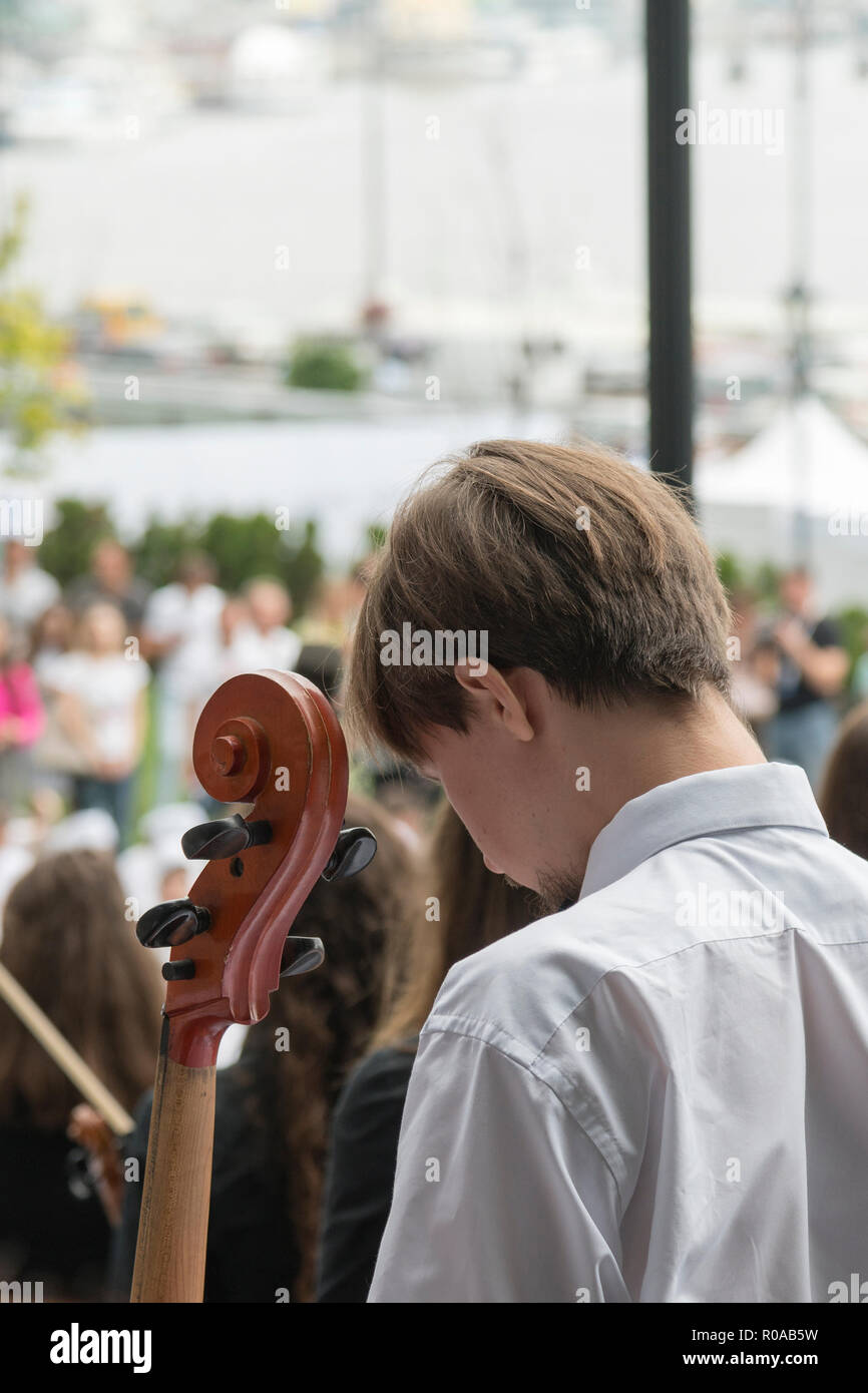Men with a cello in an orchestra. Vertical photo Stock Photo - Alamy