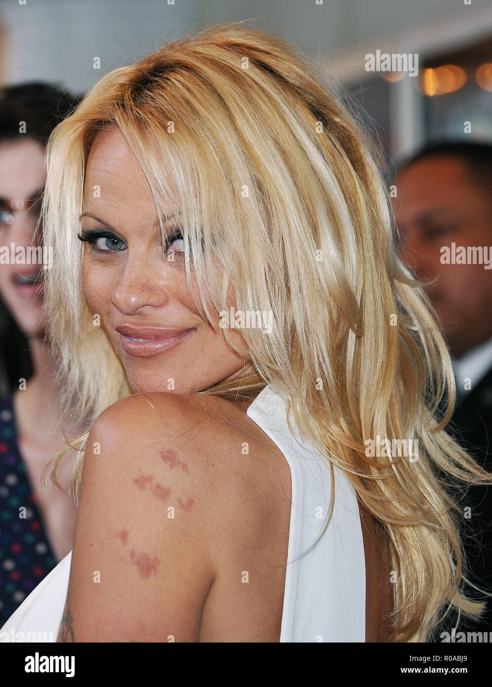 Headshot smile eye contact over the shoulder tattoo hi-res stock ...