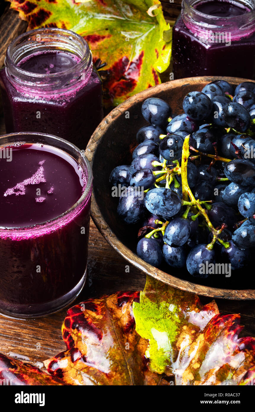 Red grape juice in glass and grape fruit.Natural healthy drink Stock ...