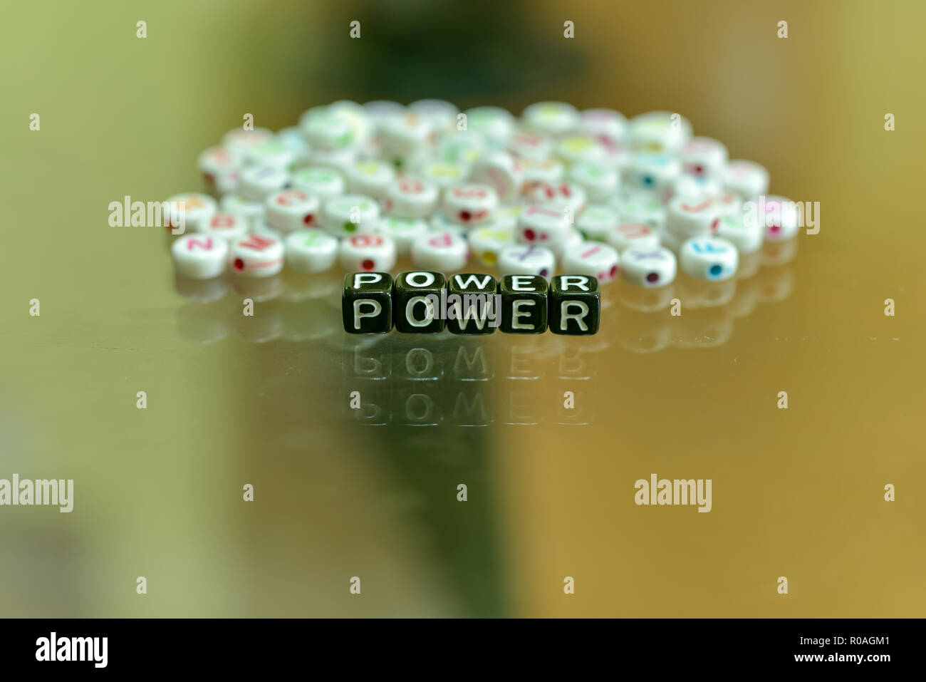 POWER written with Acrylic Black cube with white Alphabet Beads on the ...