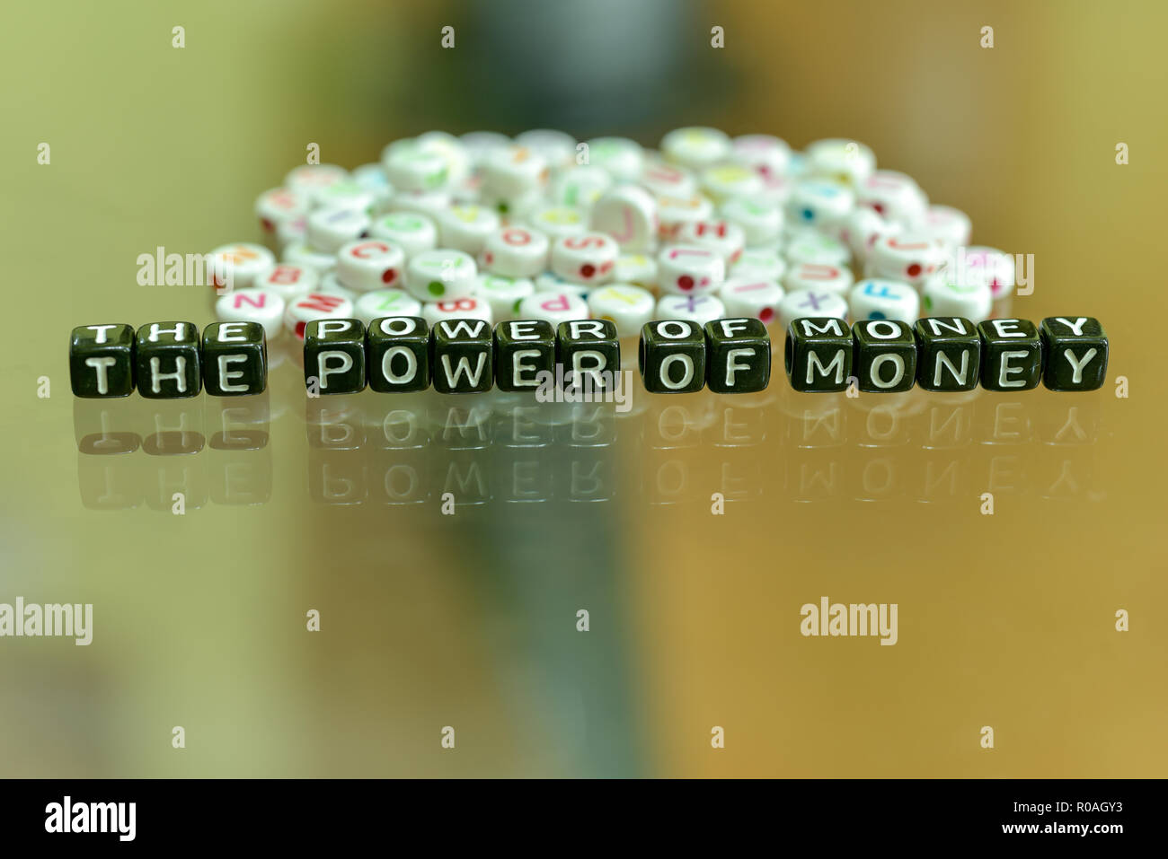 THE POWER OF MONEY written with Acrylic Black cube with white Alphabet ...