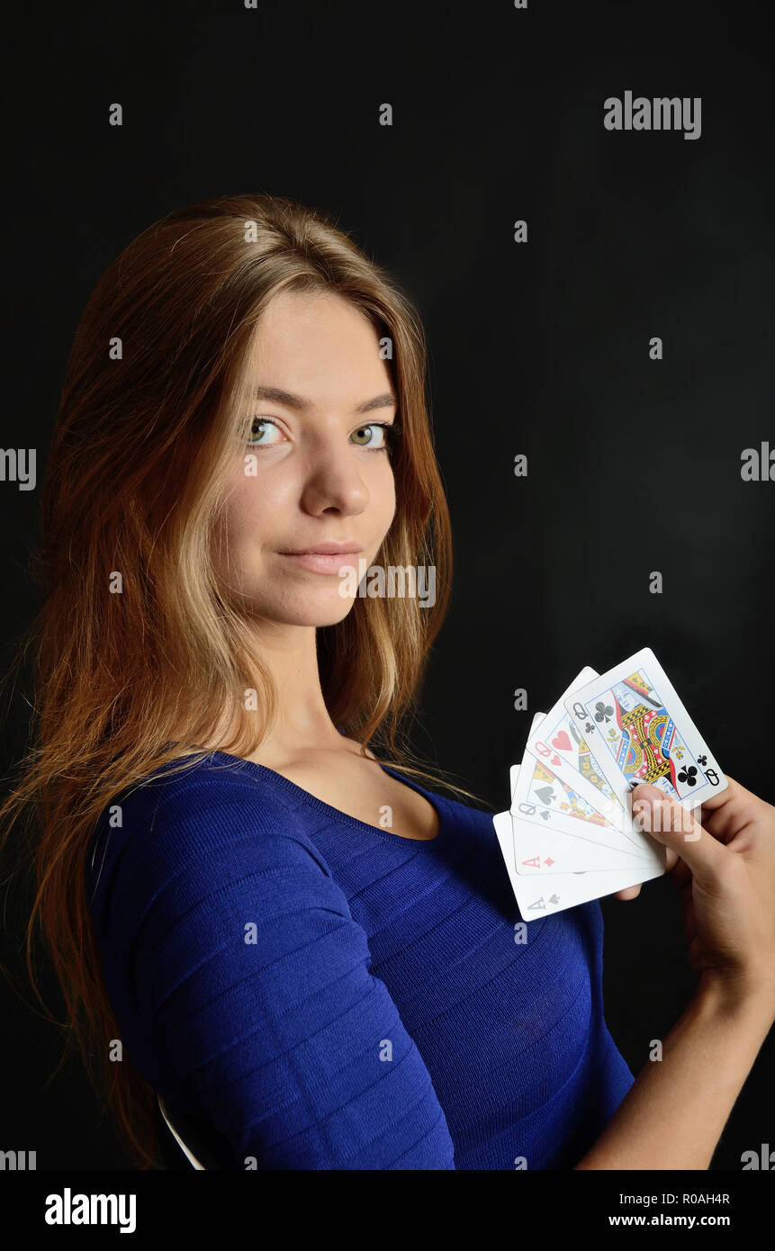 Young woman portrait with black background. Female model holding five ...