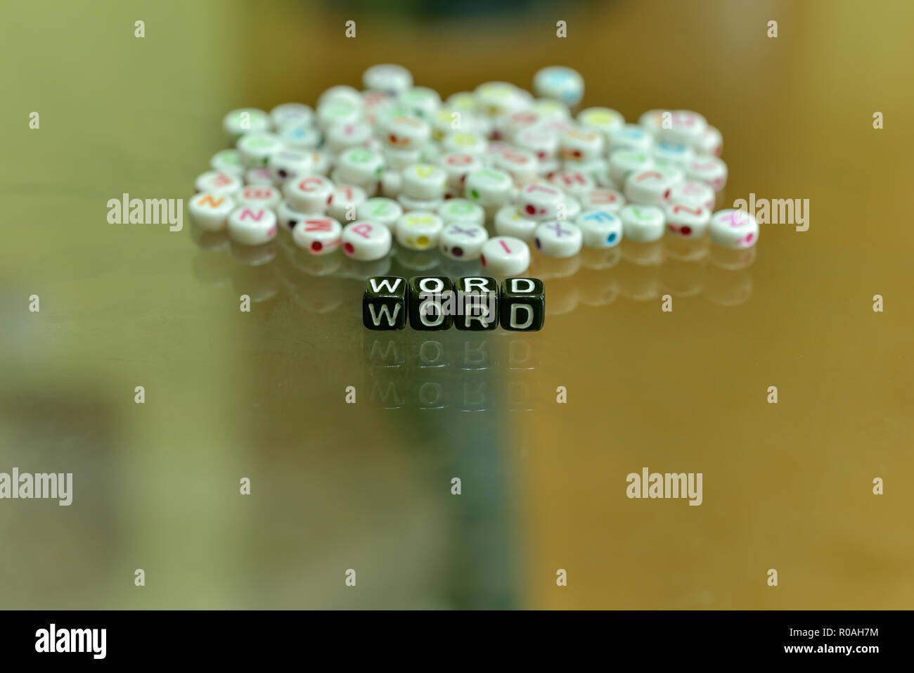 WORD written with Acrylic Black cube with white Alphabet Beads on the ...