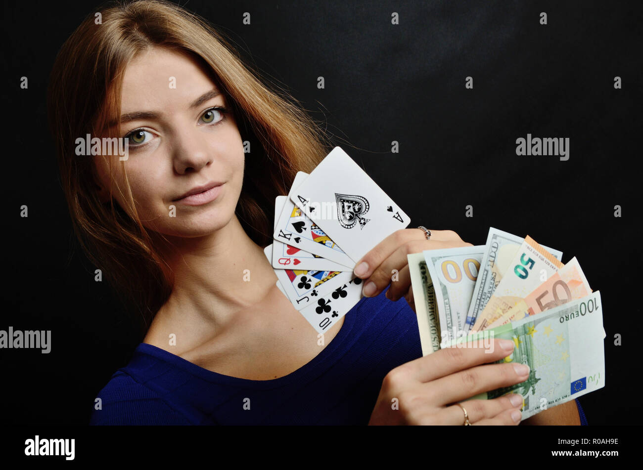 Young woman portrait with black background. Female model holding five ...
