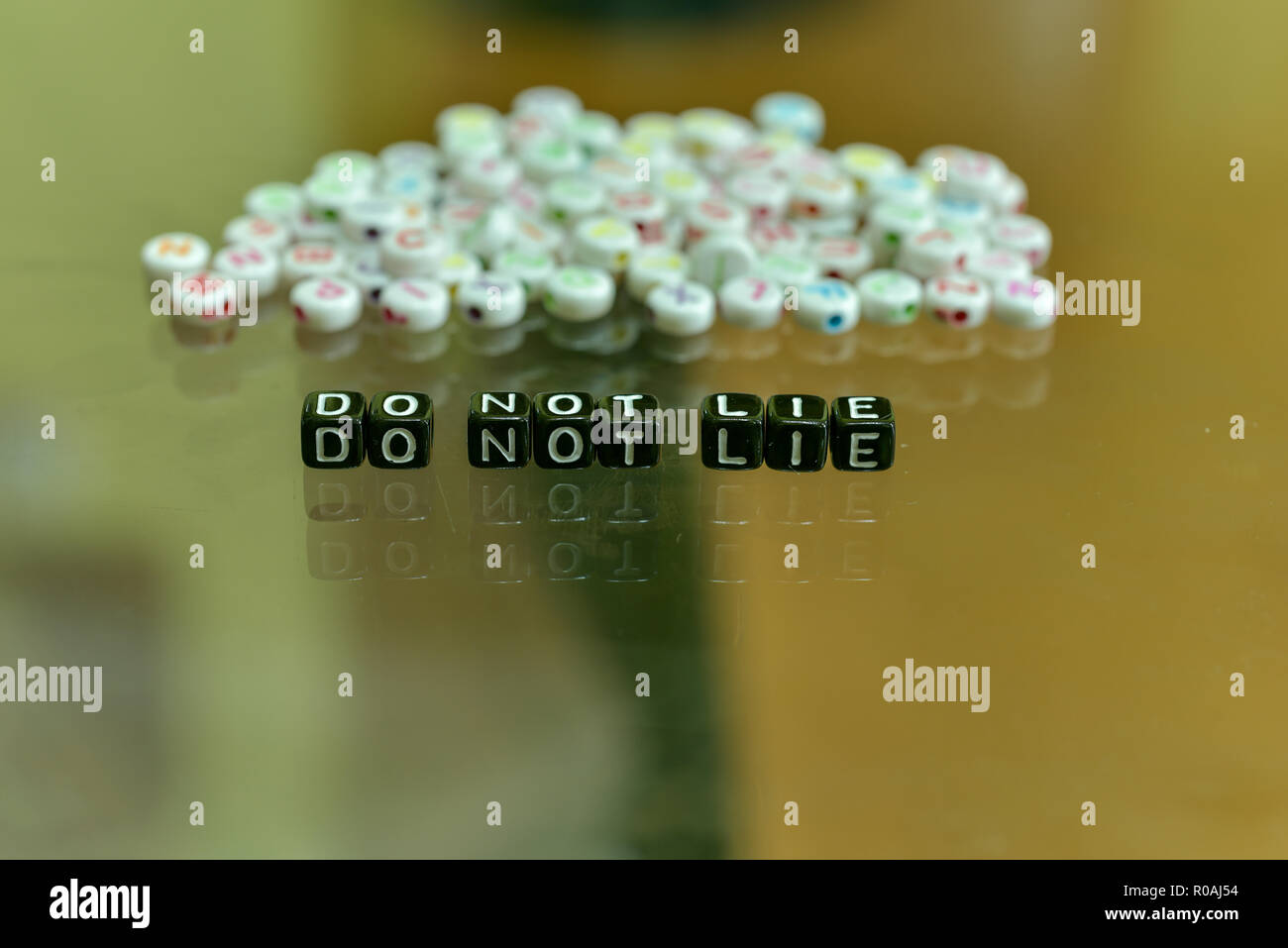 DO NOT LIE written with Acrylic Black cube with white Alphabet Beads on ...