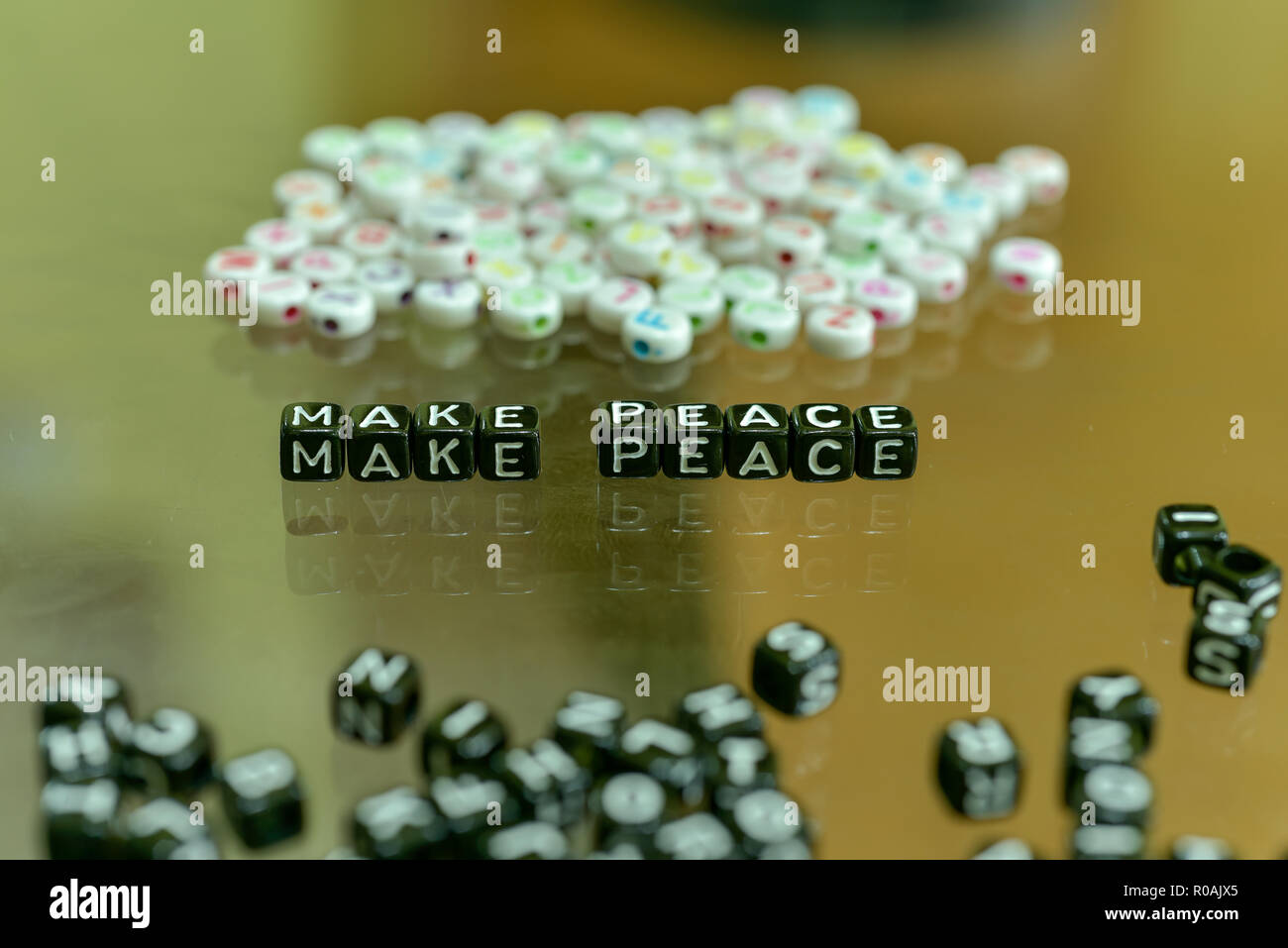 MAKE PEACE written with Acrylic Black cube with white Alphabet Beads on ...