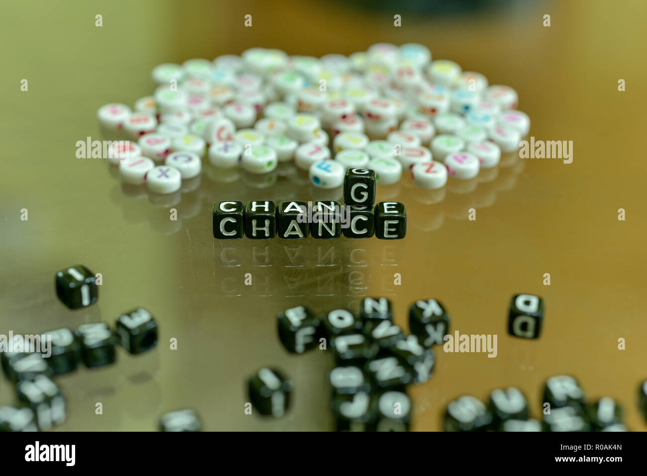 CHANGE OR CHANCE written with Acrylic Black cube with white Alphabet ...