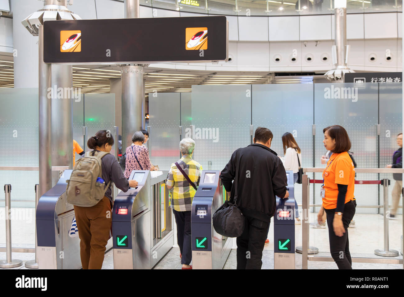 People passing through ticket machines in High Speed Rail Station, West ...