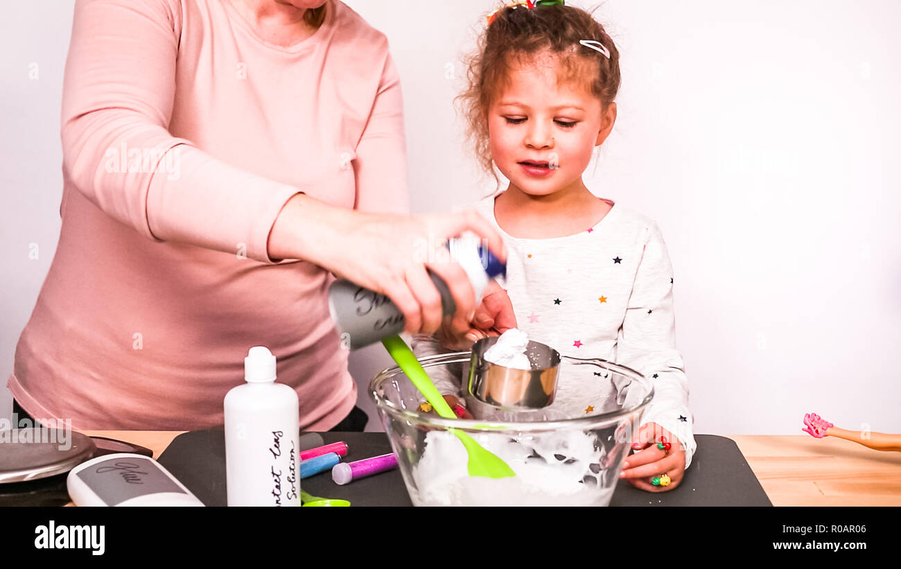 Step by step. Mother and daughter making colorful fluffy slime Stock ...