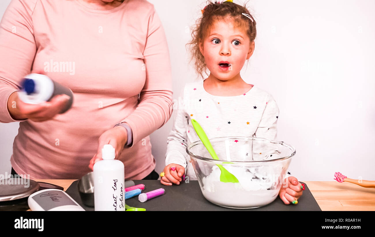Step by step. Mother and daughter making colorful fluffy slime Stock ...