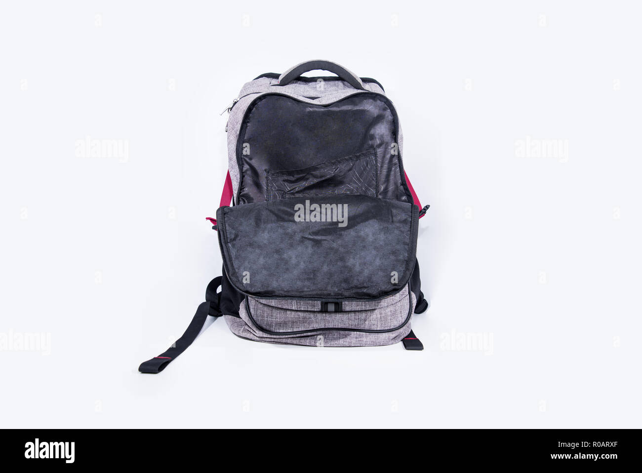 Empty gray backpack isolated on white background Stock Photo - Alamy