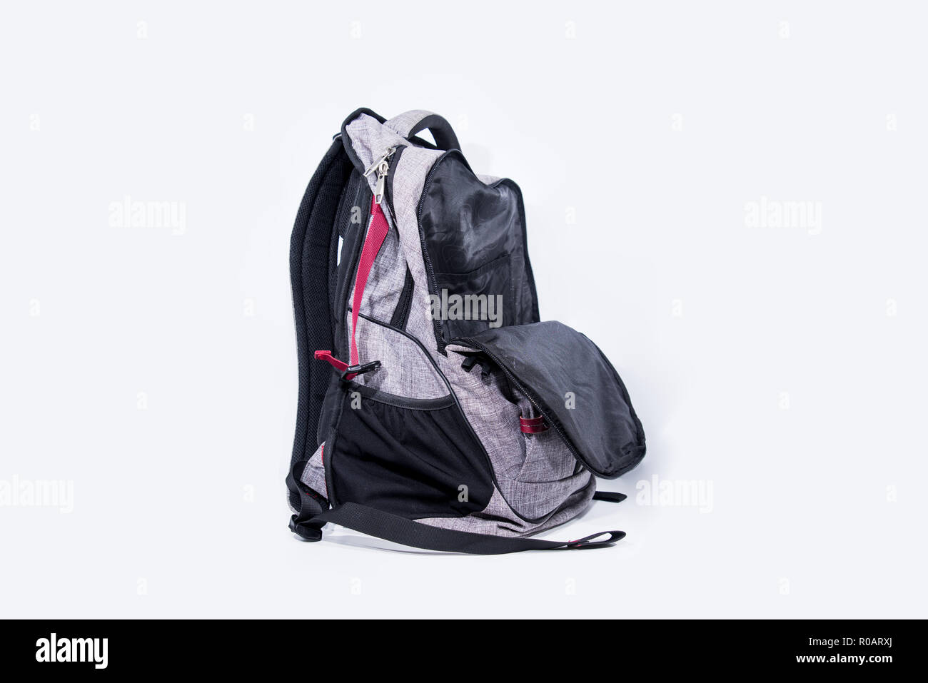 Empty gray backpack isolated on white background Stock Photo - Alamy