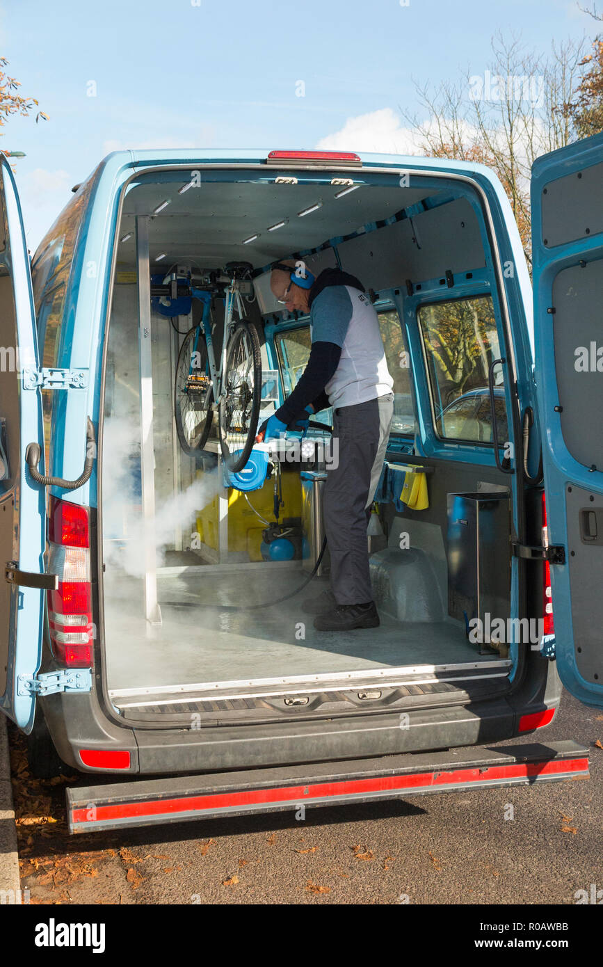 A bike / bicycle / cycle / bi cycle being cleaned under pressure at a ...