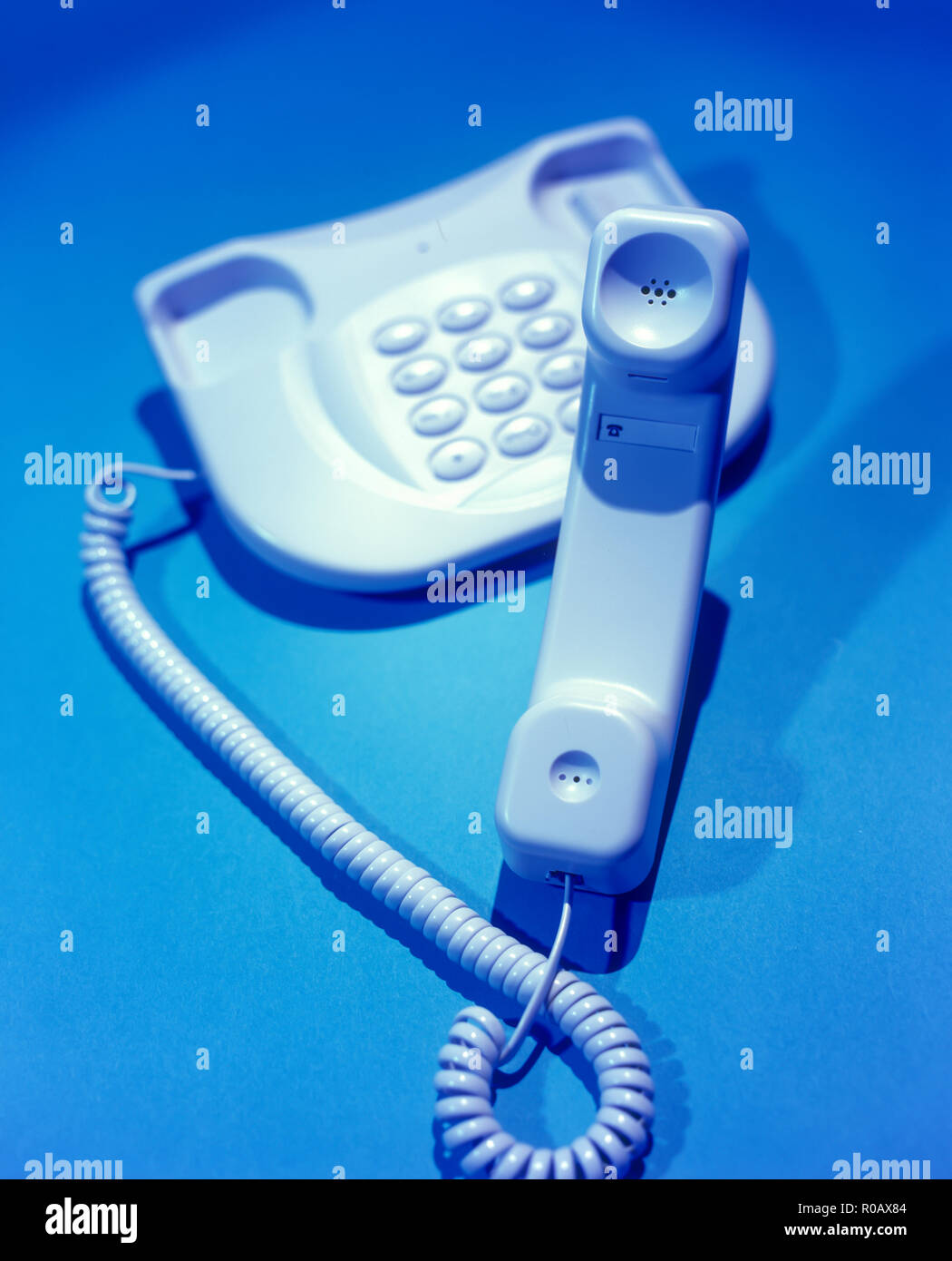 1997 HISTORICAL WHITE LAND LINE TELEPHONE ON PLAIN BLUE BACKGROUND ...