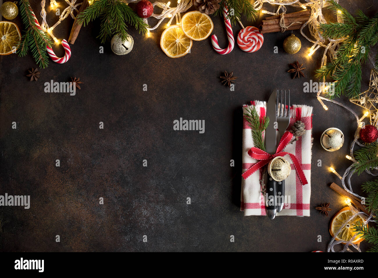 Christmas table setting and border with lights, golden balls, fir ...