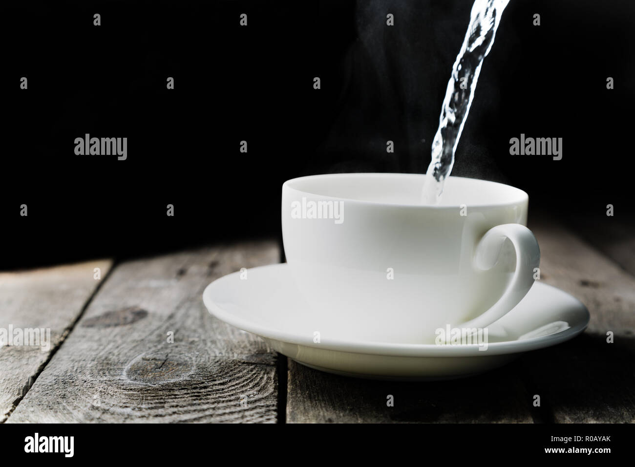 Pouring water in cup hi-res stock photography and images - Alamy
