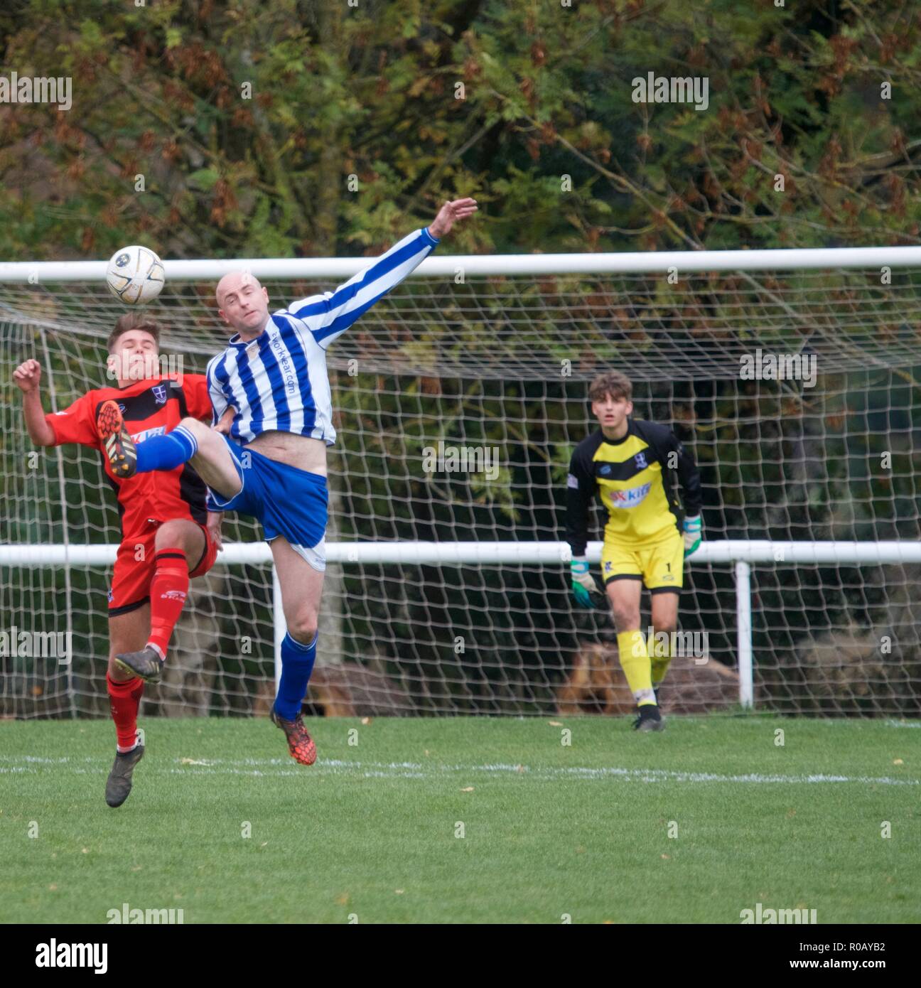 Football action from an amateur match between Whaley Bridge Athletic ...