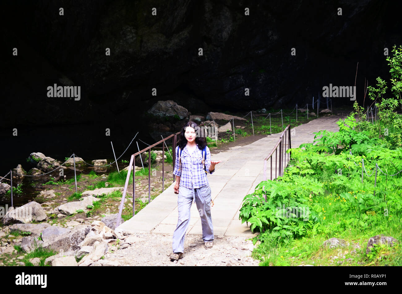 Girl walking in cave hi-res stock photography and images - Alamy
