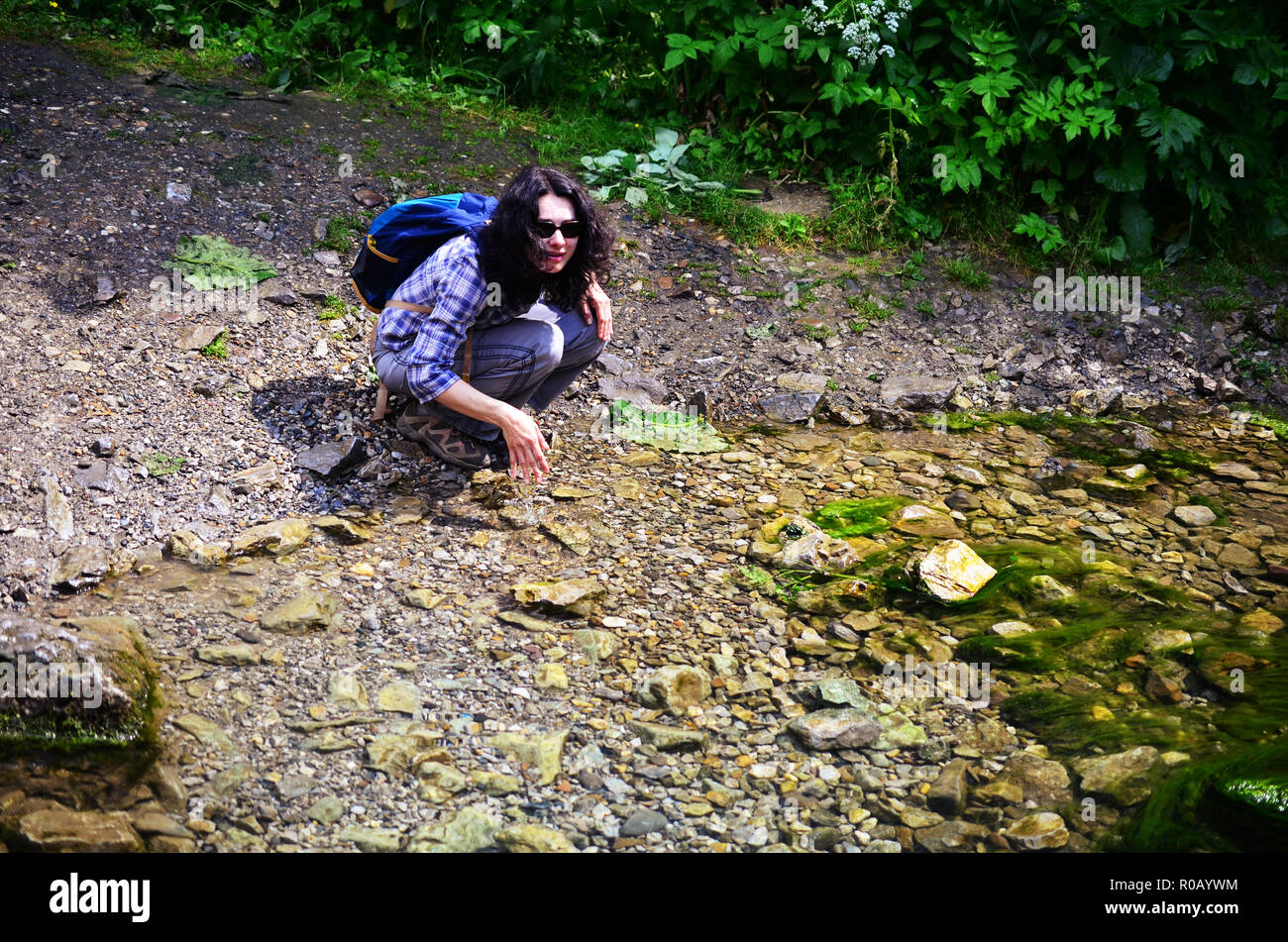 Woman drinking water from river hi-res stock photography and images - Alamy