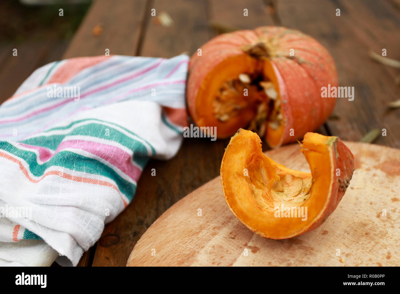 Pumpkin on picnic table in the fall Stock Photo - Alamy