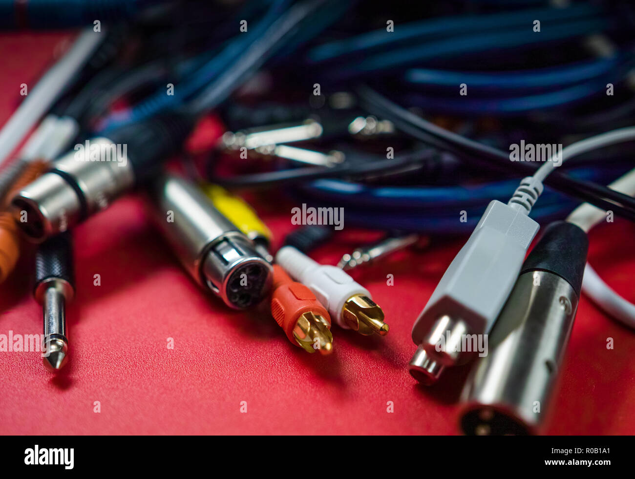 A multitude of cables for recording and sound purposes. XLR, RCA, and ...