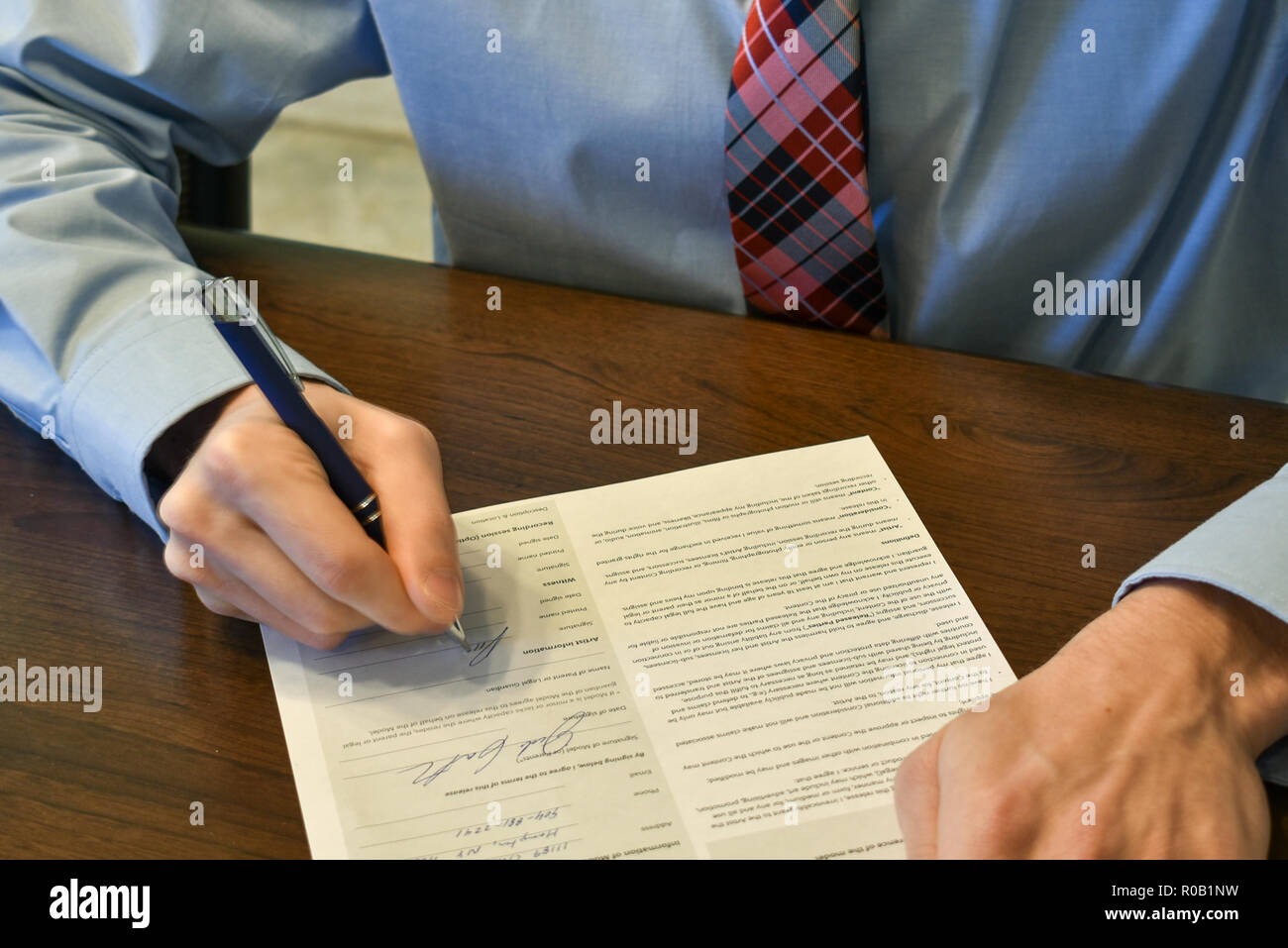 Signing forms work hi-res stock photography and images - Alamy