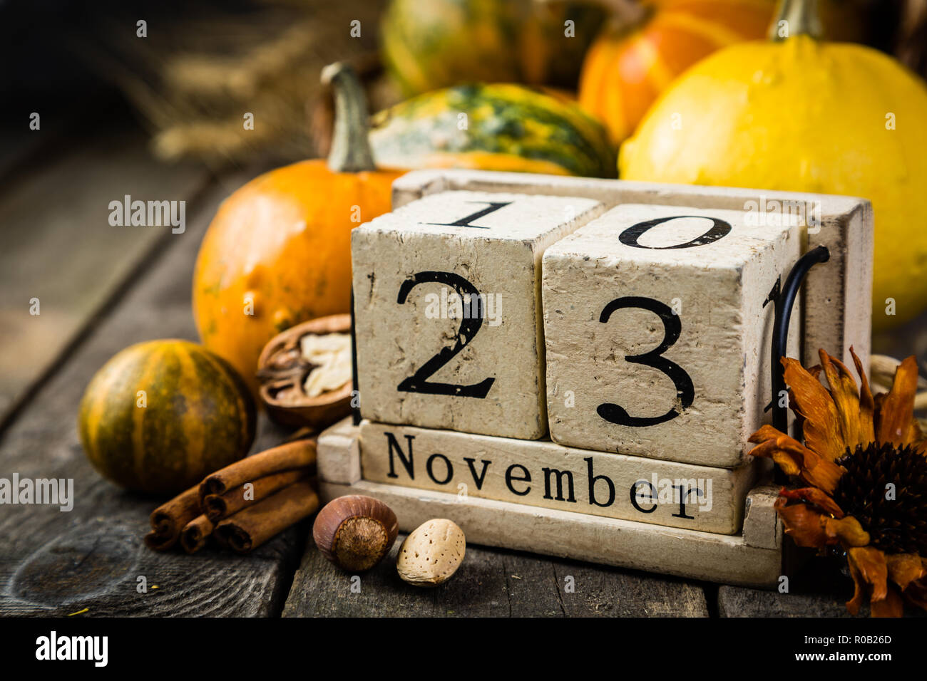 Thanksgiving concept - calendar date with decorations and pumpkins on ...