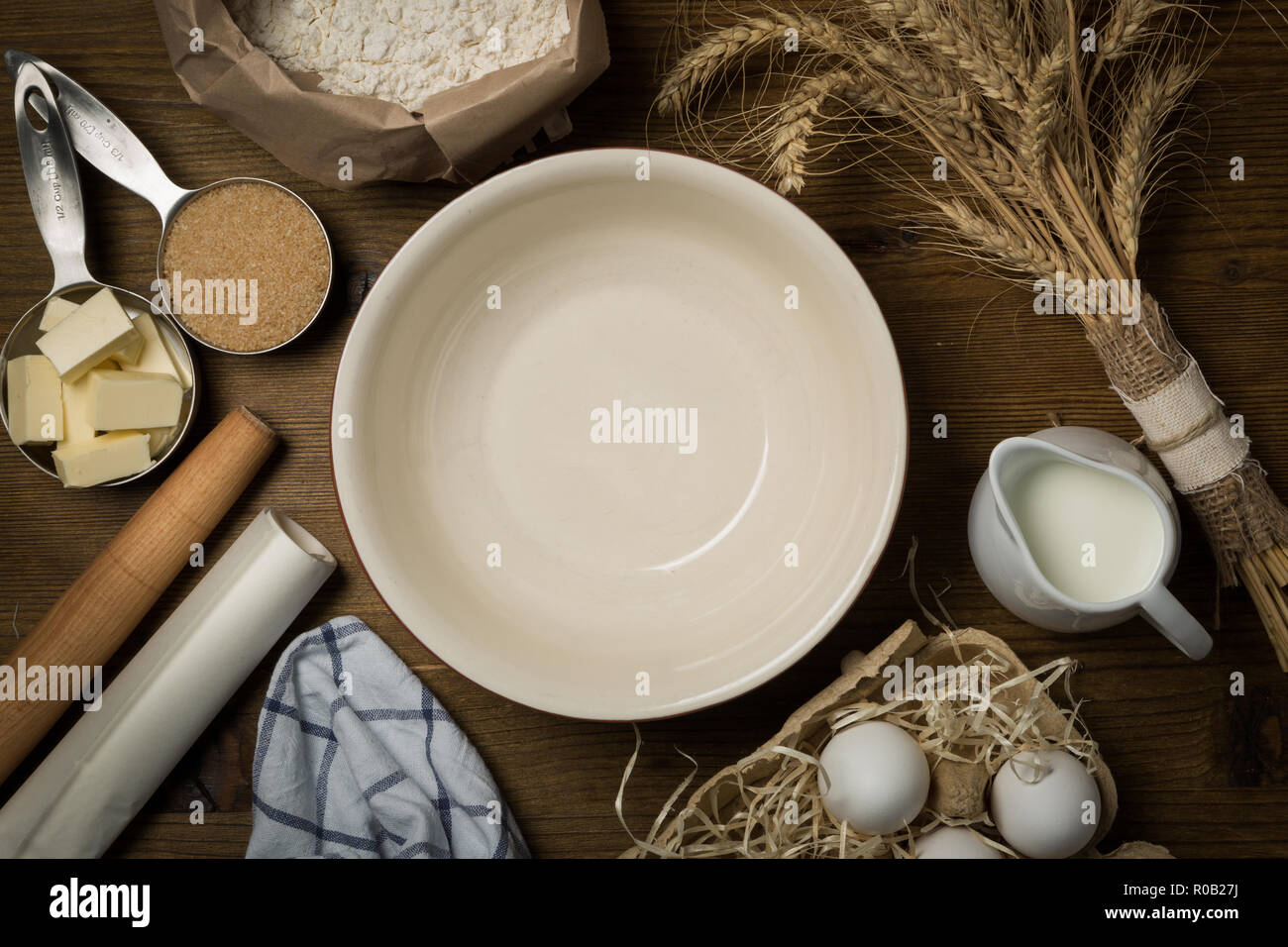 Baking ingredients in measuring cups, rustic wood background Stock ...