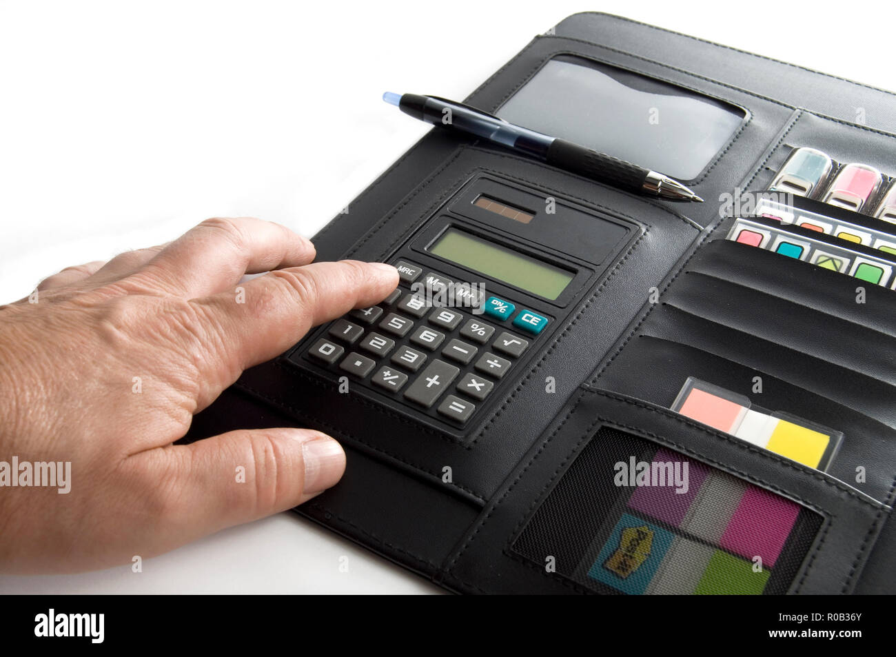 Working with the calculator hi-res stock photography and images - Alamy