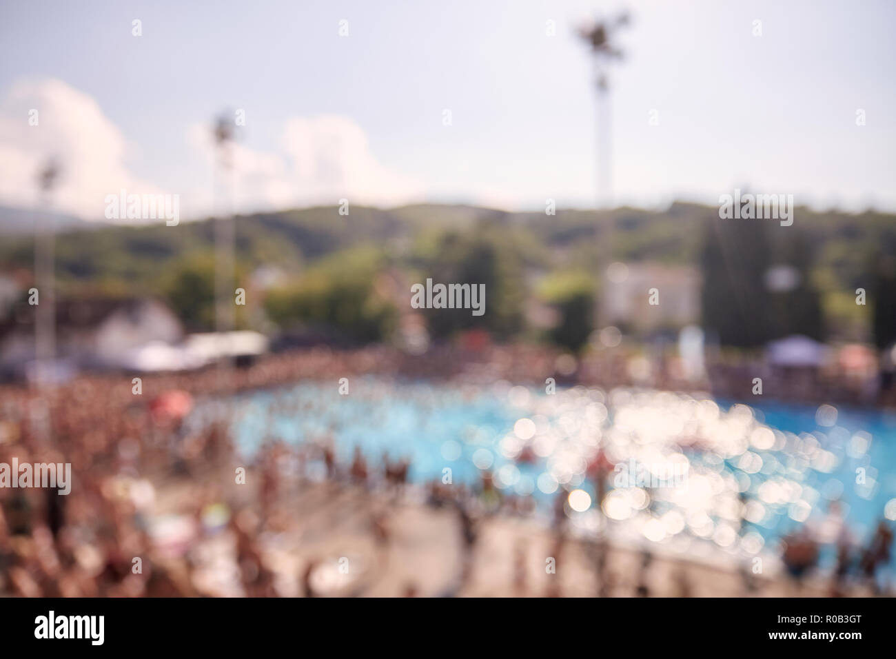 out of focus, defocused shot, group of unrecognizable people outdoors ...