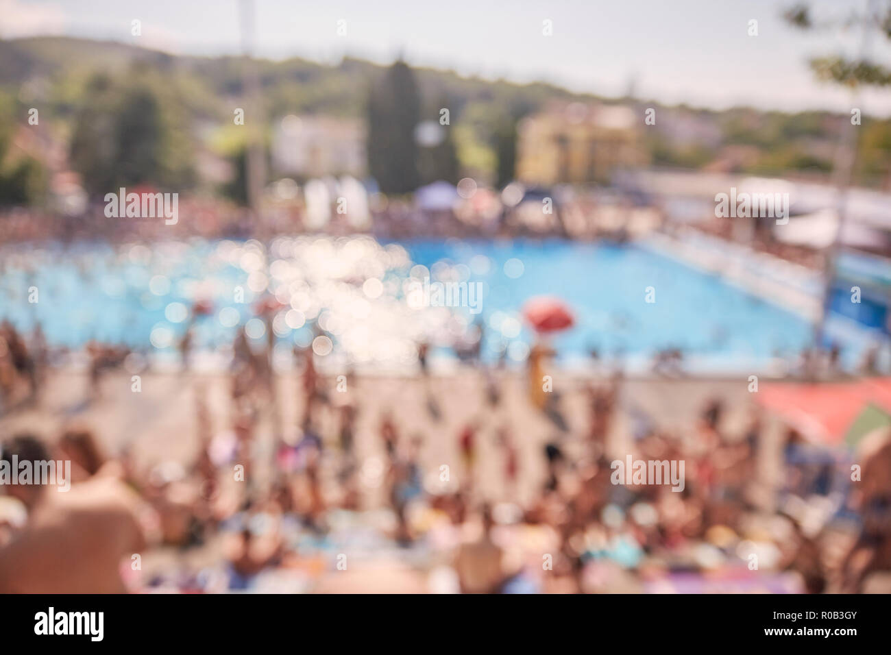 out of focus, defocused shot, group of unrecognizable people outdoors ...