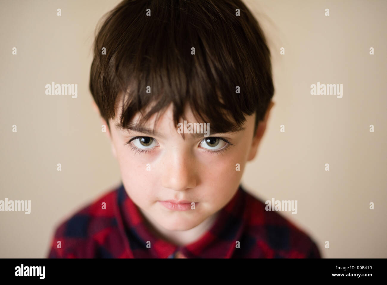 portrait of small lonely sad pensive caucasian boy with big eyes in ...