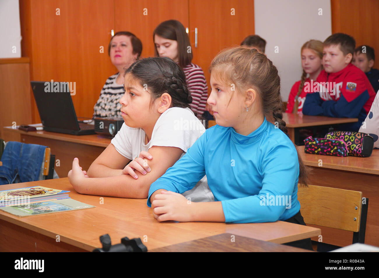 Kids Listen To Teacher High Resolution Stock Photography and Images - Alamy
