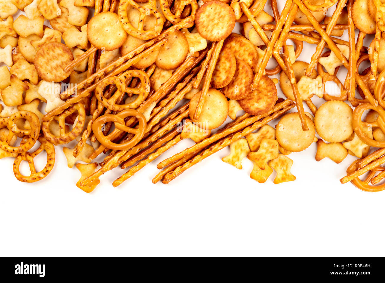 An assortment of salt crackers, sticks, pretzels, and goldfishes, shot ...