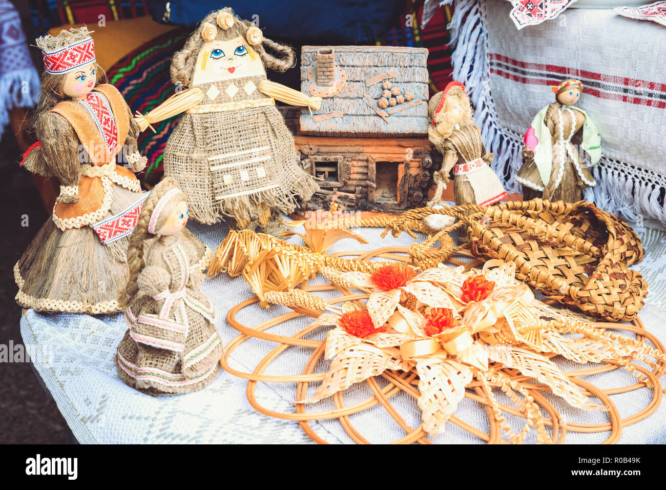 Belarusian national dolls and souvenirs from straw and wood Stock Photo ...