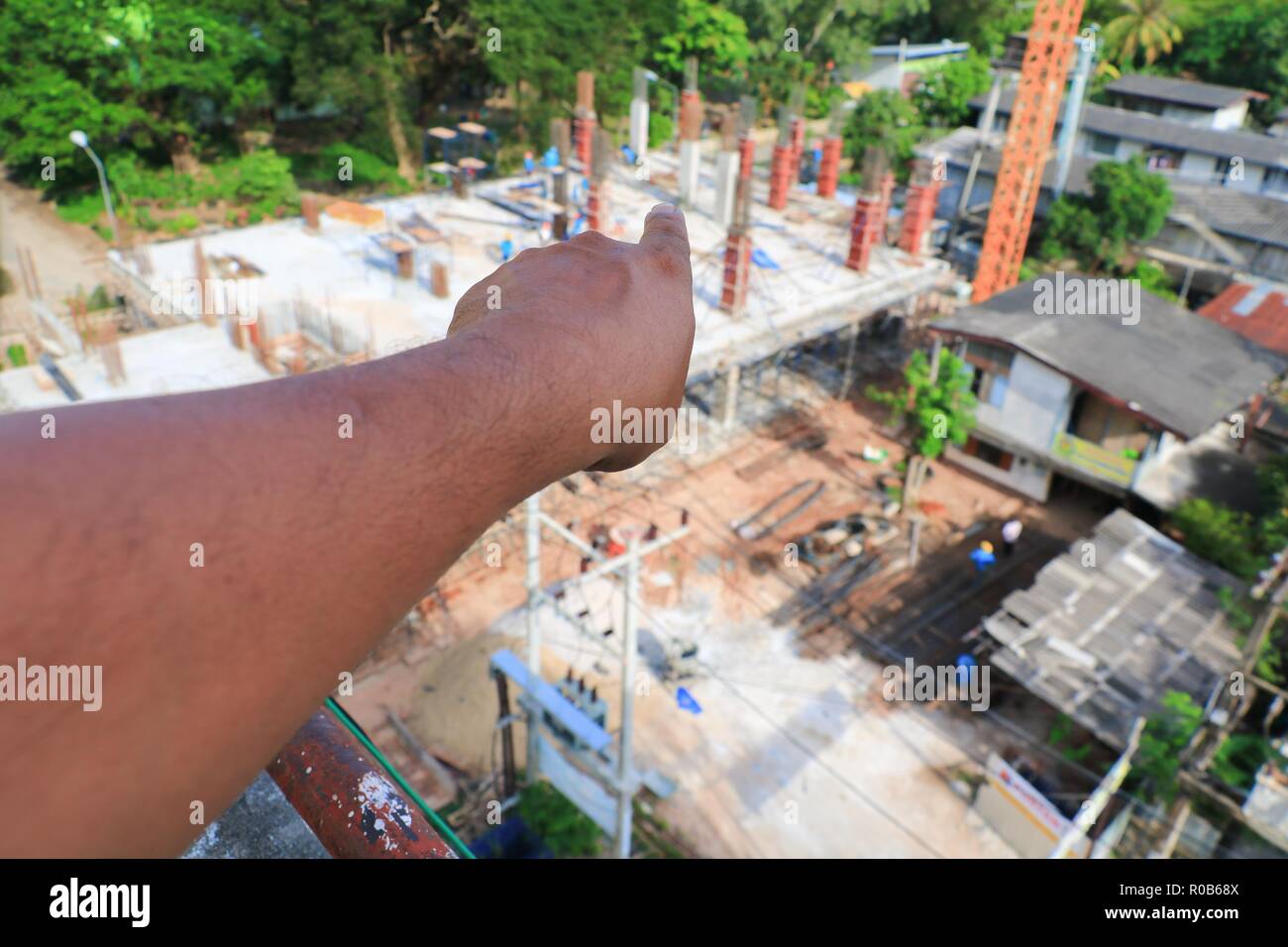 pointing at a building under construction Stock Photo - Alamy
