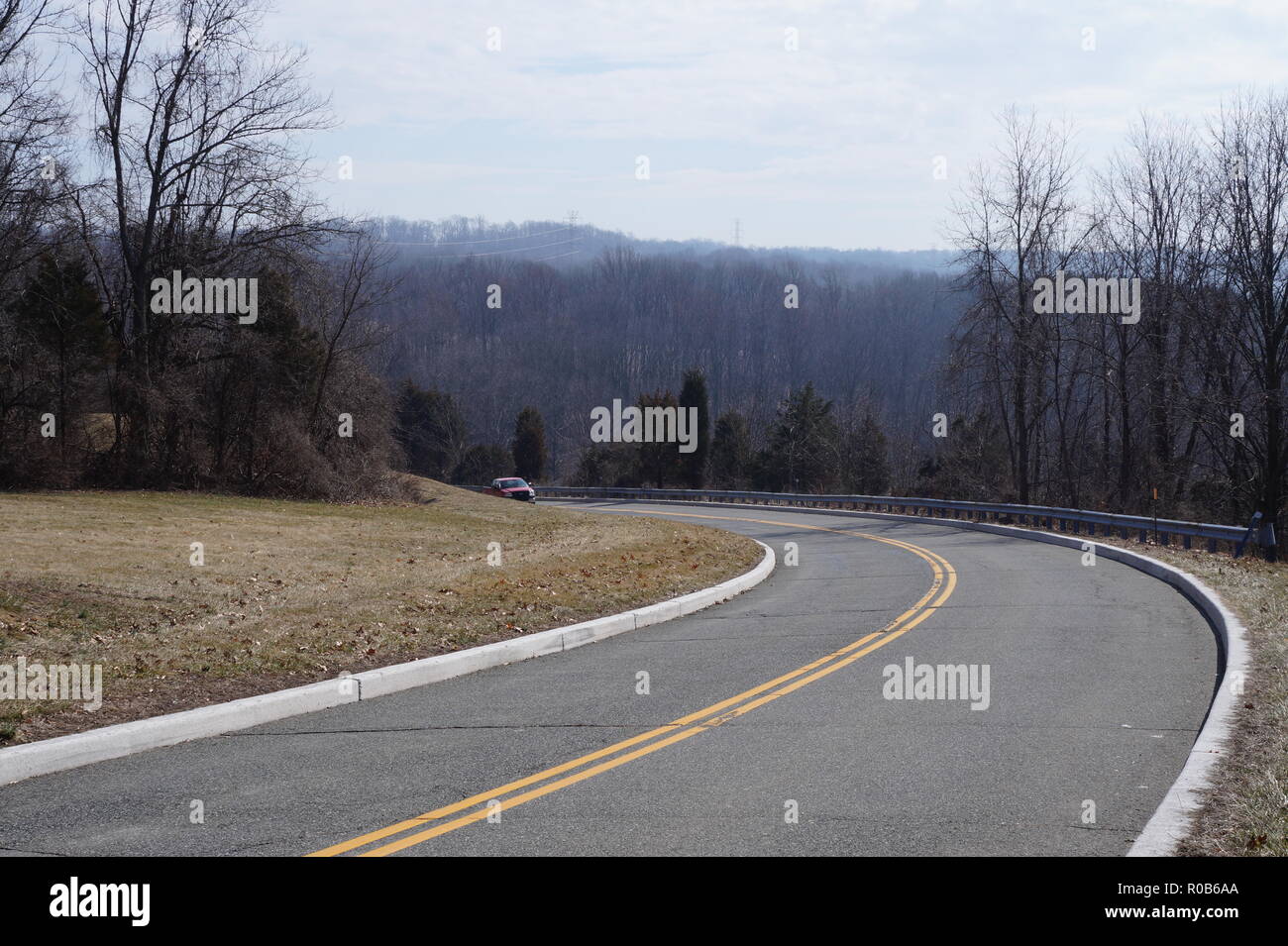 A road trip down a winding road Stock Photo - Alamy