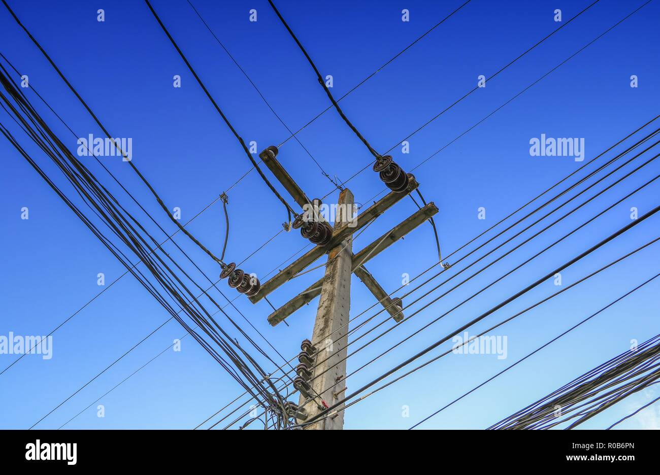 electricity post high voltage and cable line on Sky Blue background ...